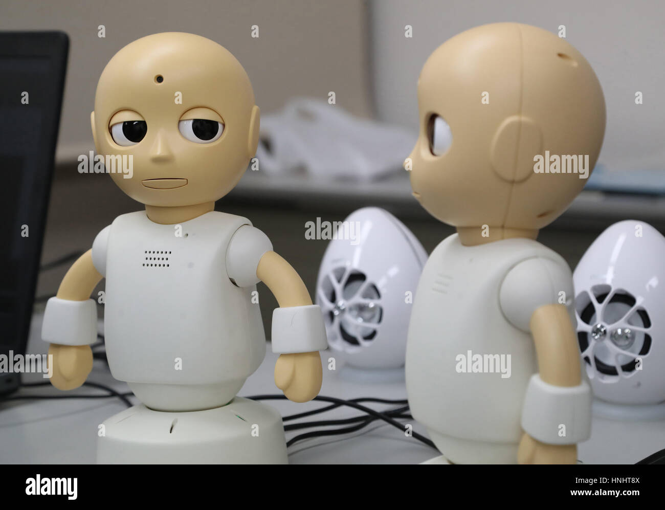 Tokyo, Japan. 13th Feb, 2017. Tiny twin robots "CommU" chat with user ...