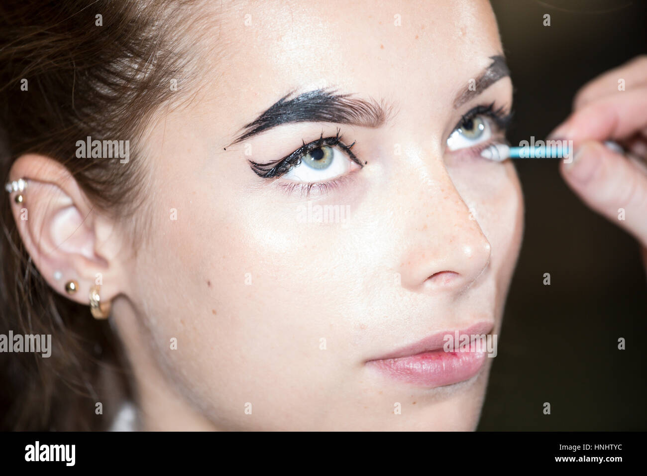 New York, NY, USA - February 13, 2017: Model prepares backstage for the ...