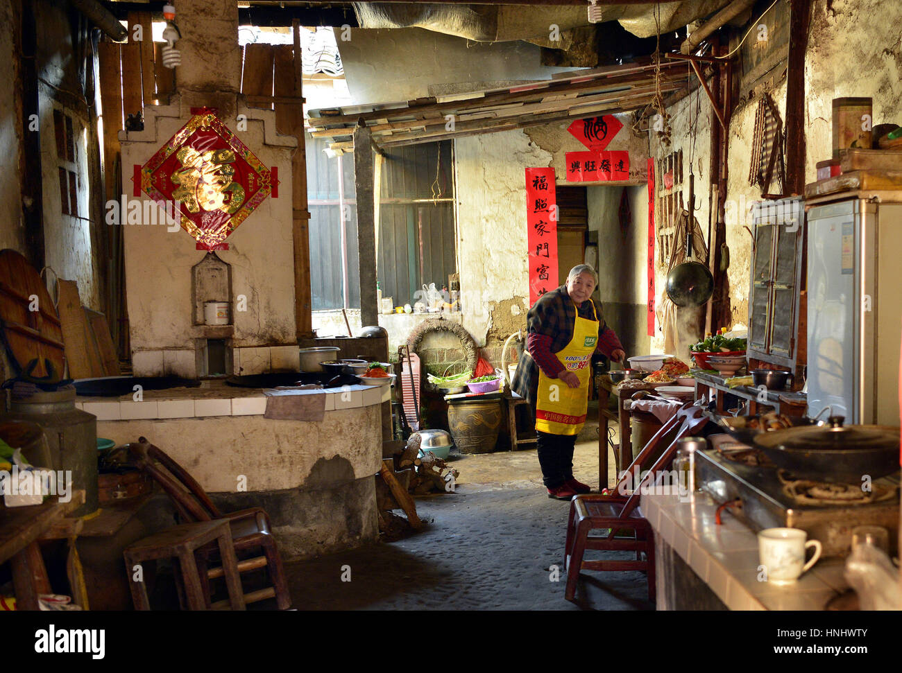 Liu'an, China's Anhui Province. 13th Feb, 2017. An elder cooks at home ...