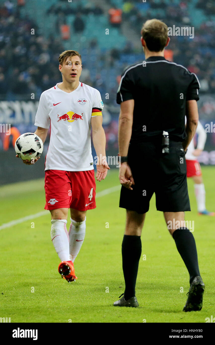 Referee Sascha Stegemann yellow cards Leipzig's Willi Orban during the ...