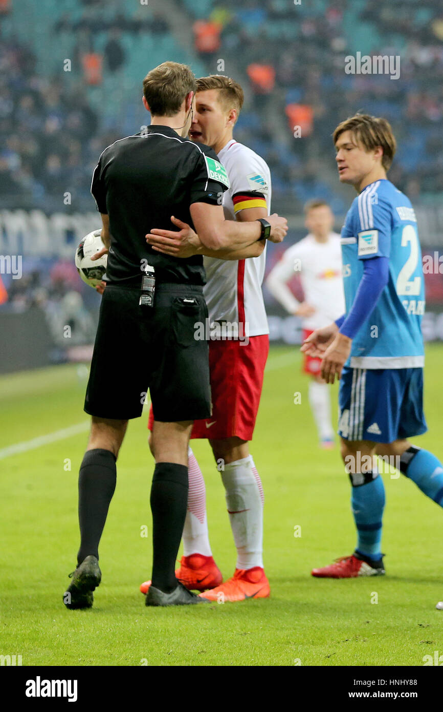 Referee Sascha Stegemann yellow cards Leipzig's Willi Orban during the ...