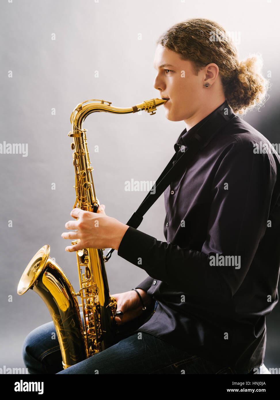 Teen sax player hi-res stock photography and images - Alamy