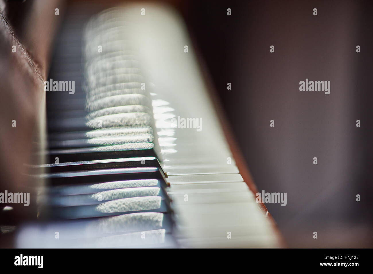 Piano Keyboard backlit in narrow focus and bokeh Stock Photo - Alamy