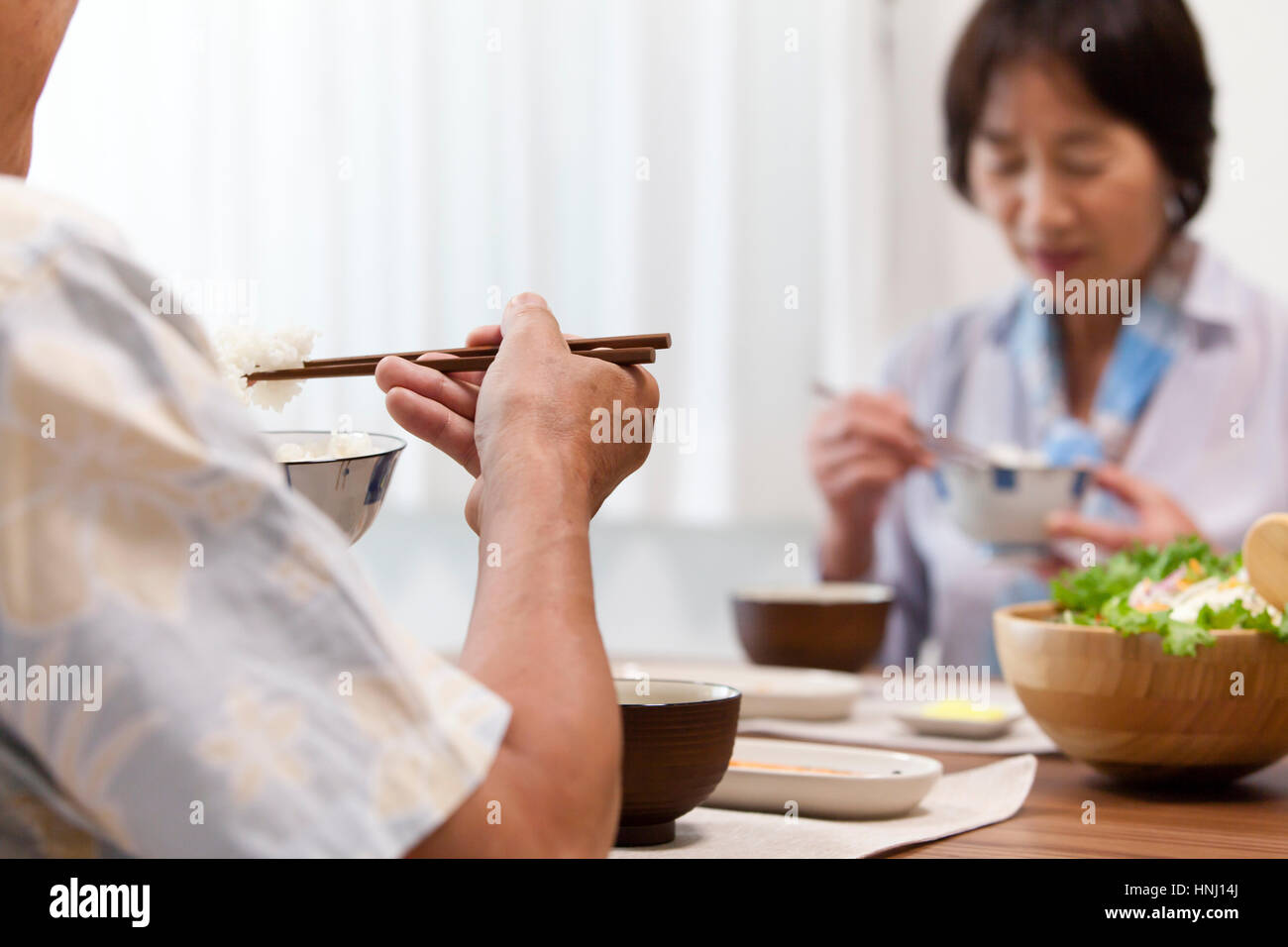 Senior people at a dining table Stock Photo - Alamy