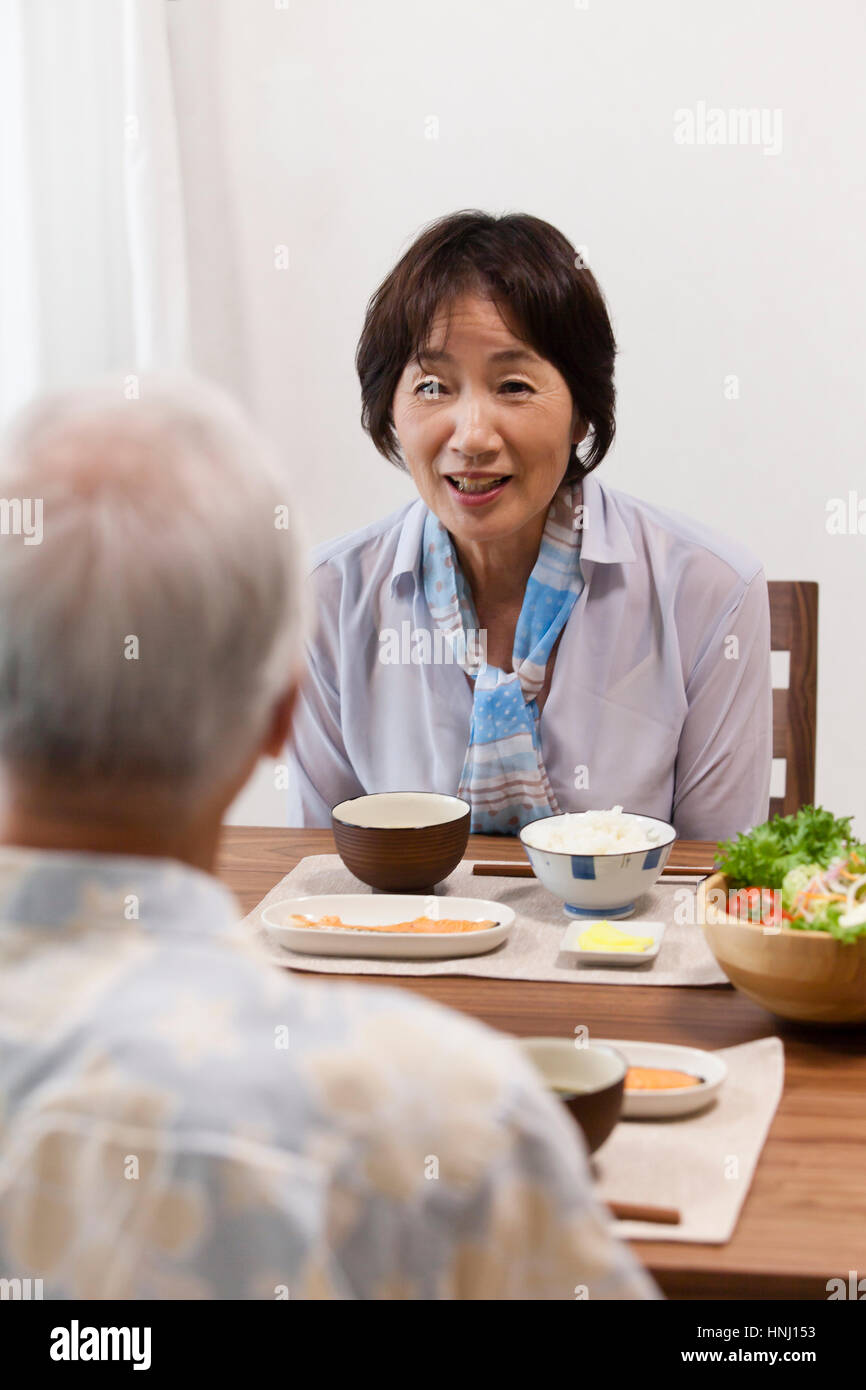 Senior people at a dining table Stock Photo - Alamy