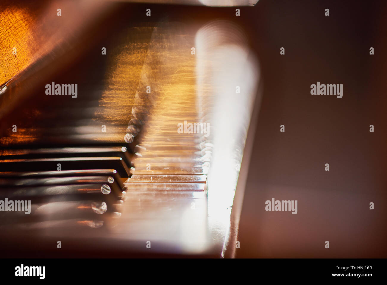 Piano Keyboard backlit in narrow focus and bokeh Stock Photo - Alamy