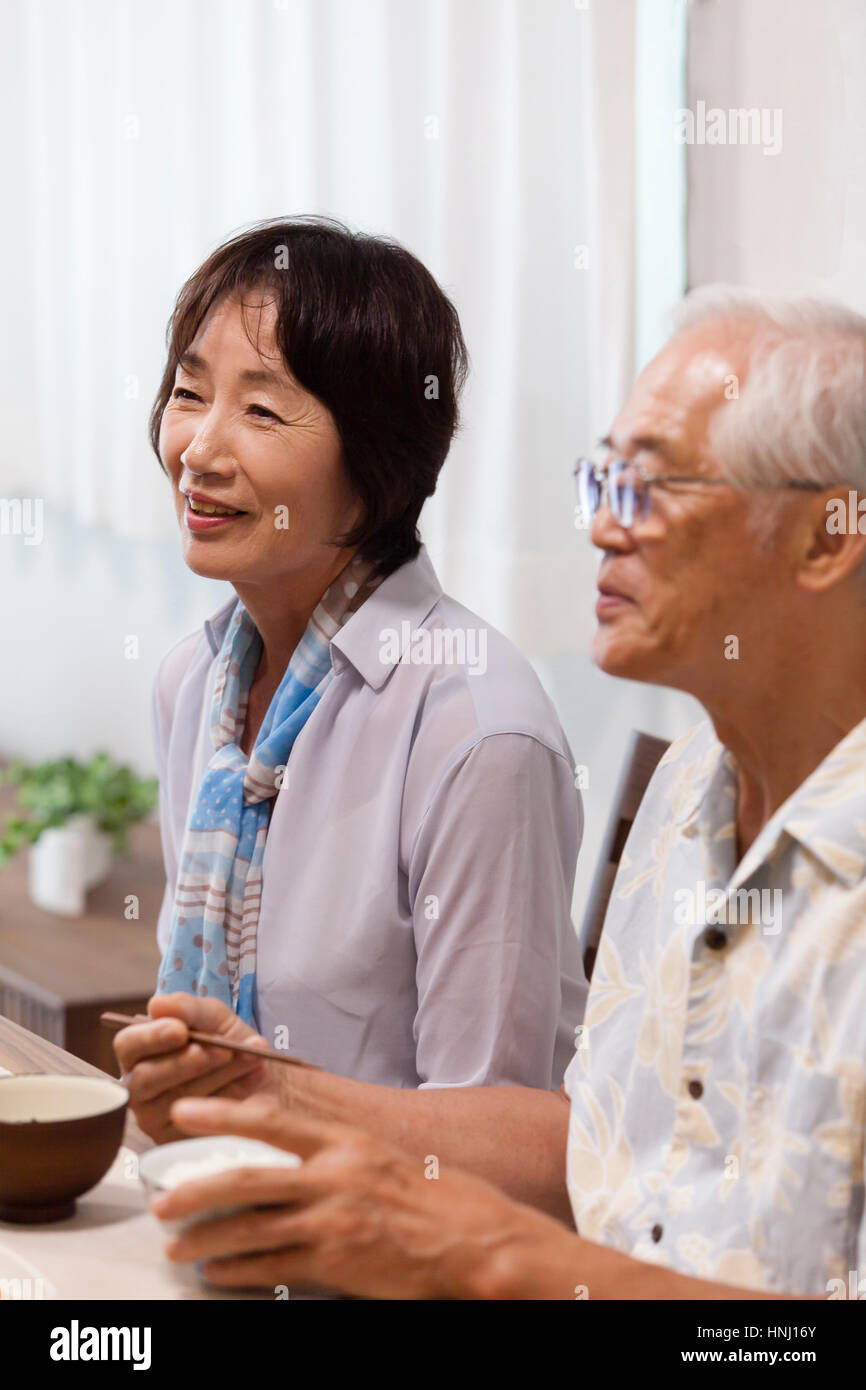 Senior people at a dining table Stock Photo - Alamy