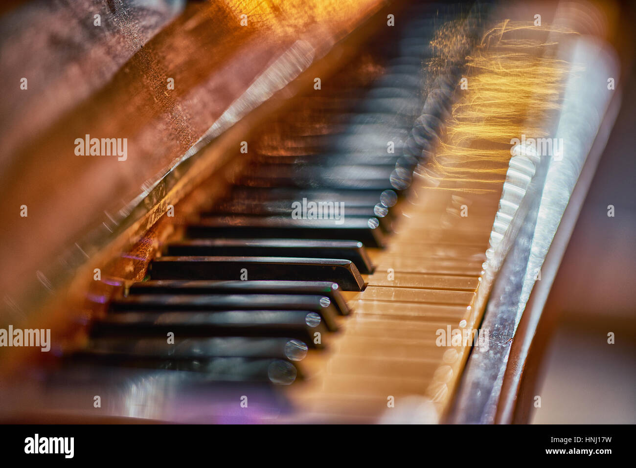 Piano Keyboard backlit in narrow focus and bokeh Stock Photo - Alamy
