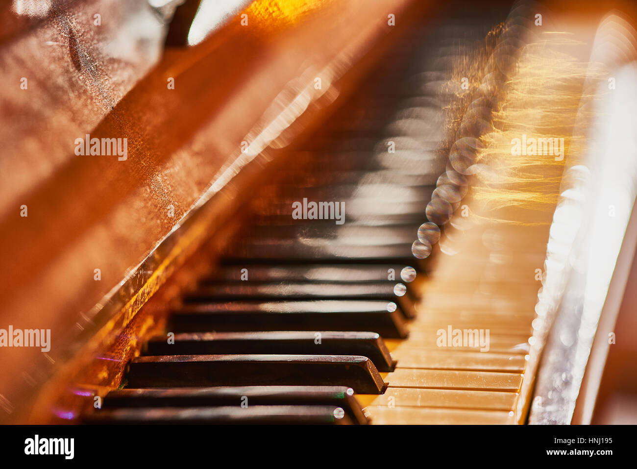 Piano Keyboard backlit in narrow focus and bokeh Stock Photo - Alamy