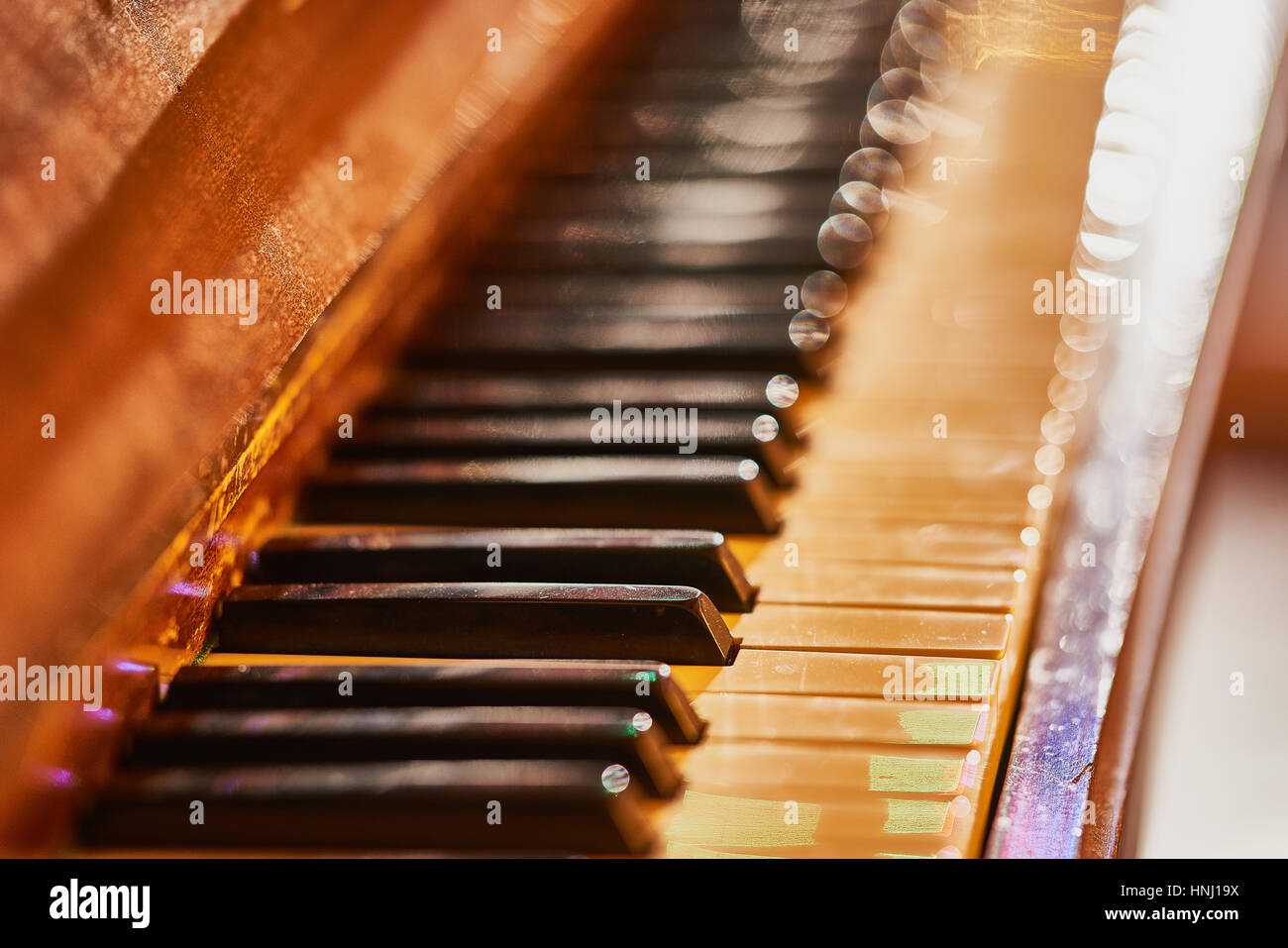Piano Keyboard backlit in narrow focus and bokeh Stock Photo - Alamy