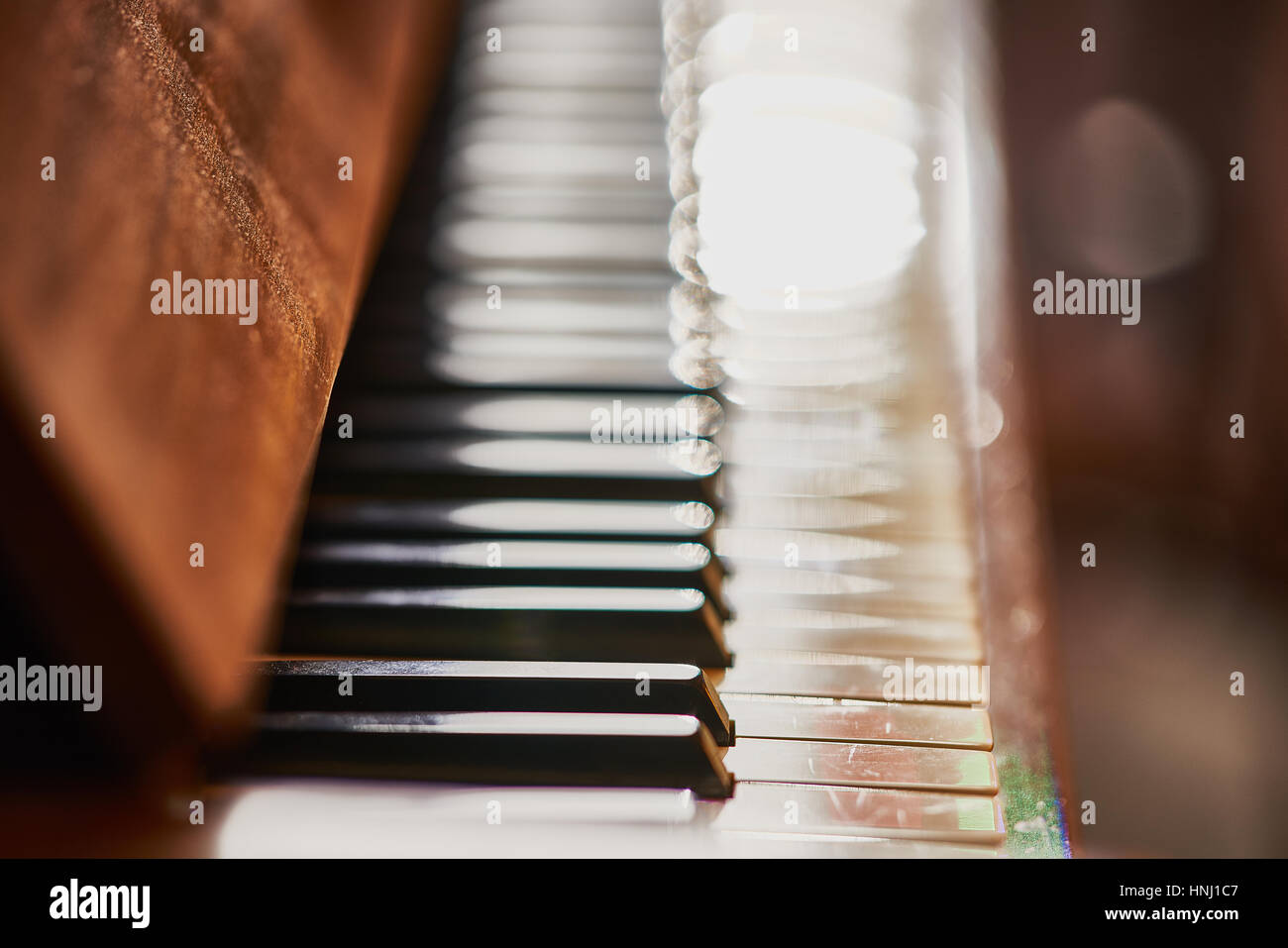 Piano Keyboard backlit in narrow focus and bokeh Stock Photo - Alamy
