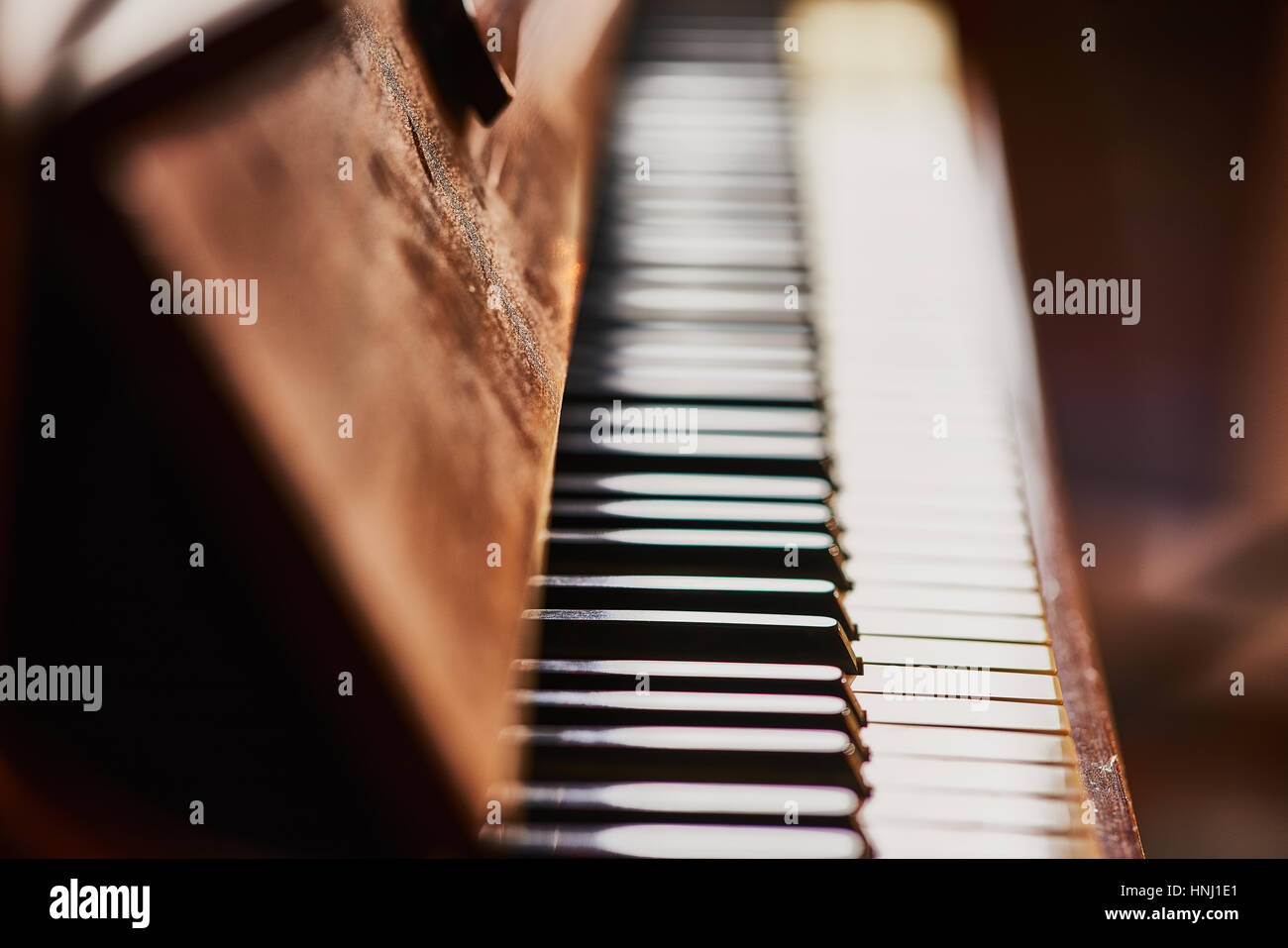 Piano Keyboard backlit in narrow focus and bokeh Stock Photo - Alamy