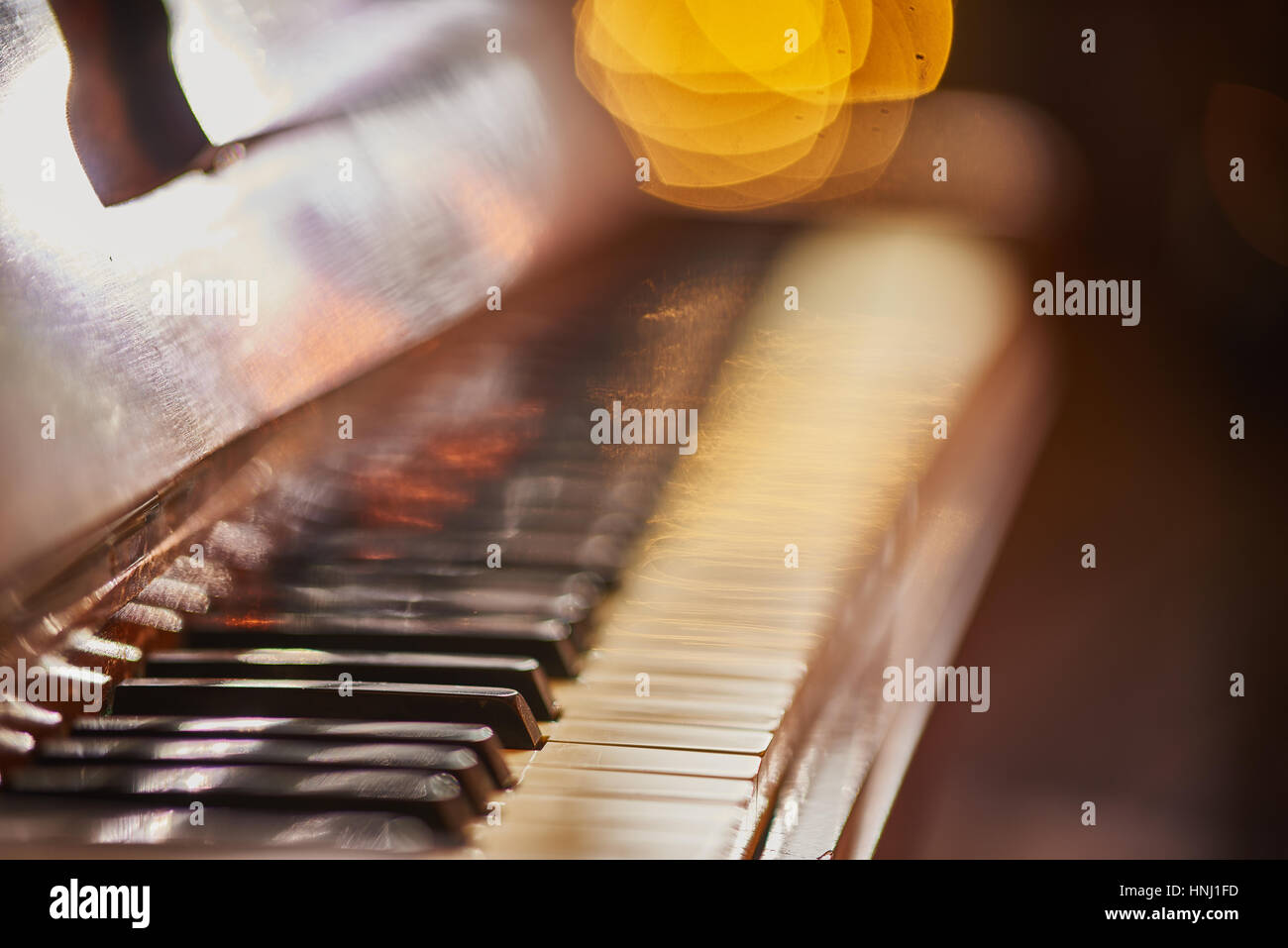Piano Keyboard backlit in narrow focus and bokeh Stock Photo - Alamy