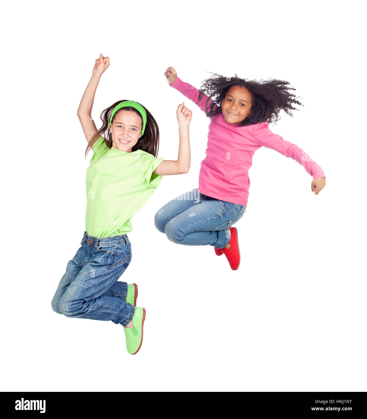Two children jumping isolated on a white background Stock Photo - Alamy
