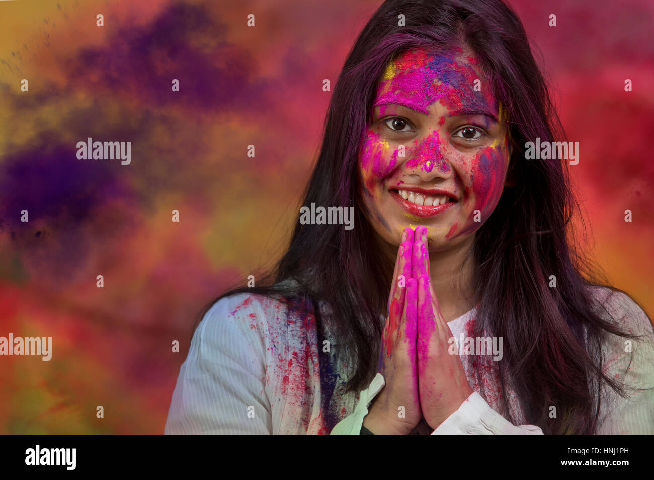 Namaste greetings at holi festival Stock Photo - Alamy