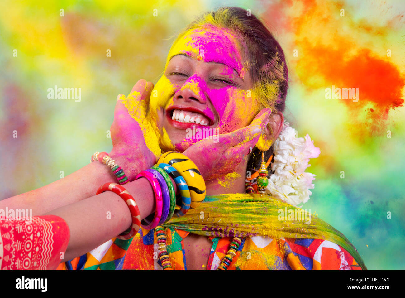 Portrait of young Indian Woman celebrating Holi color festival Stock ...