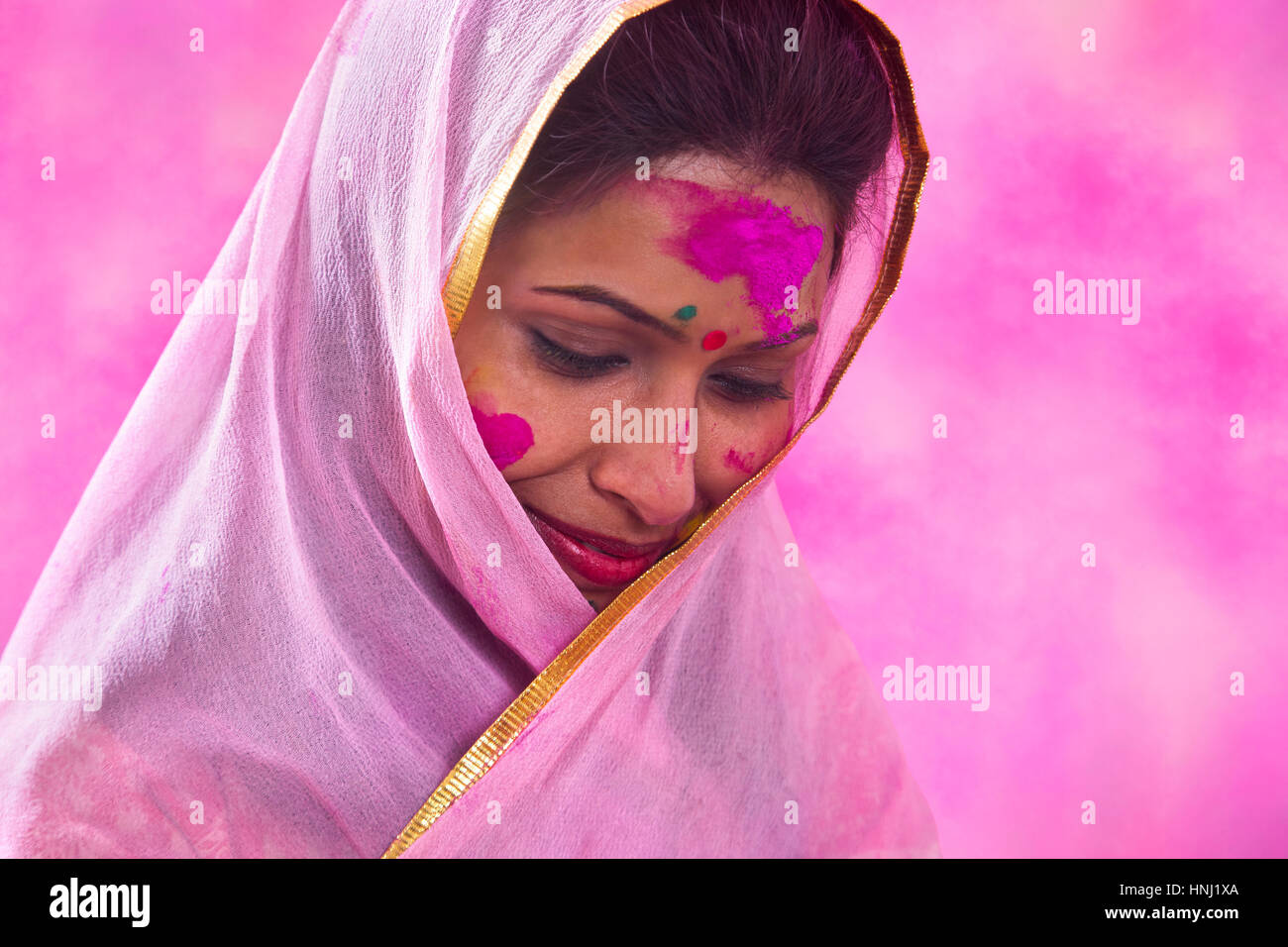 Portrait Of Young Indian Woman With Colored Face During Holi Color ...