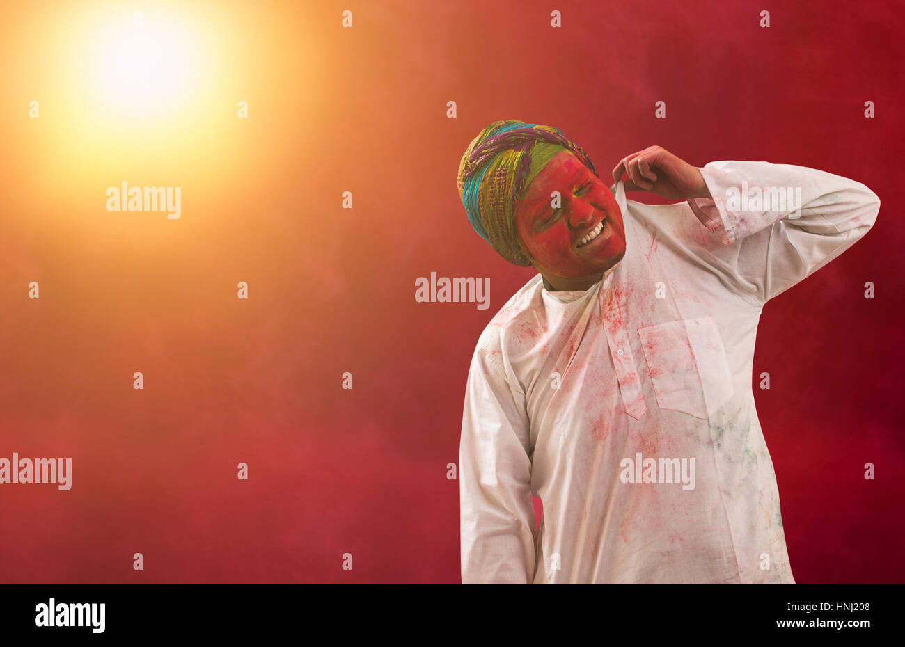 Young Indian man With Colored Face Dancing During Holi Color festival ...