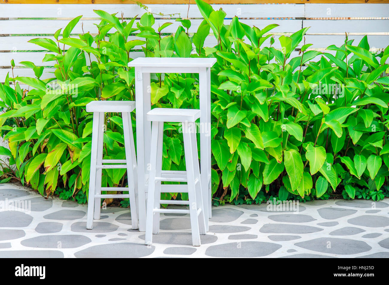 Wooden high siting table in beach club open Stock Photo - Alamy