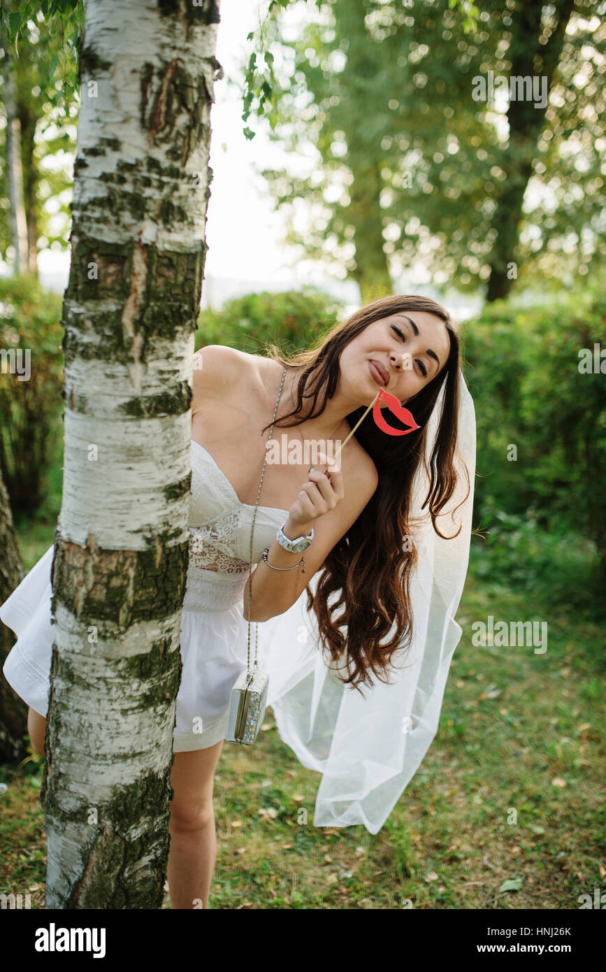 Portrait of girl on hen party with lips on a stick Stock Photo - Alamy