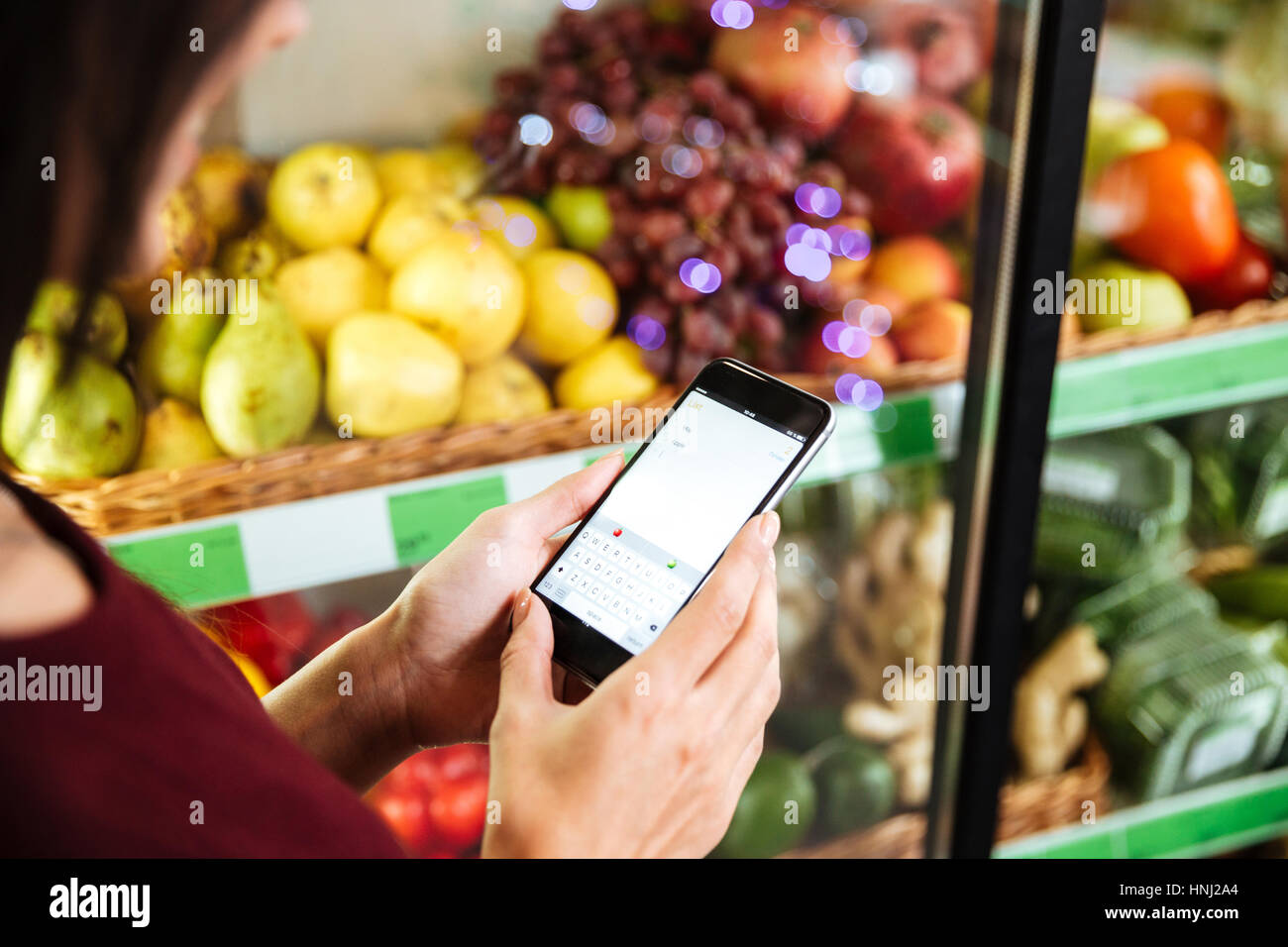 Shopper using grocery list hi-res stock photography and images - Alamy