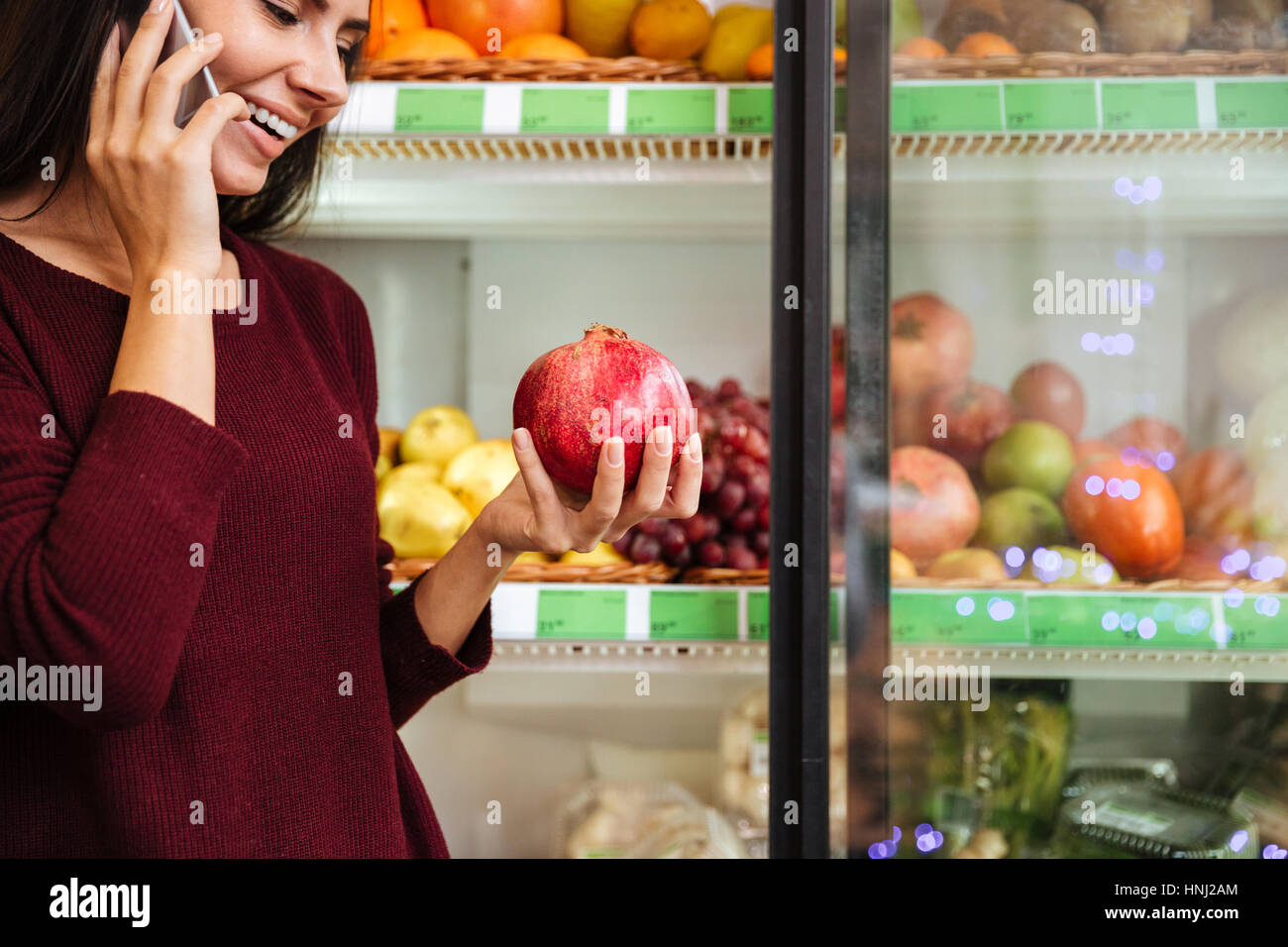 Grocery store talking cell phone hi-res stock photography and images ...