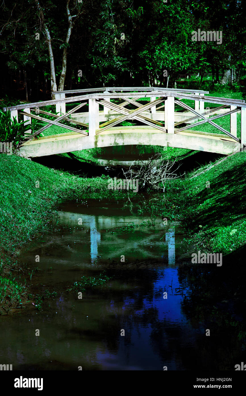 Curved Bridge over Stream Stock Photo - Alamy