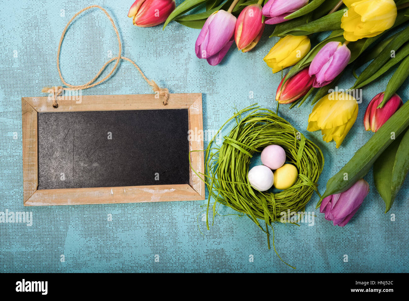Easter and spring background with tulips and eggs Stock Photo - Alamy
