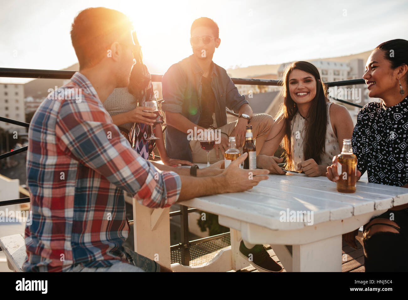 Group people sitting around table hi-res stock photography and images ...