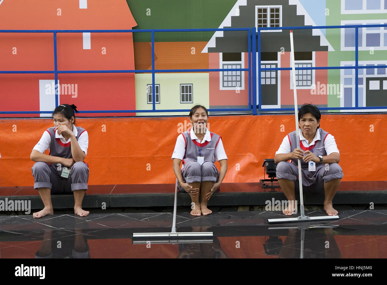 Three Thai cleaning ladies on rest break in Bakgkok, Thailand, Asia ...