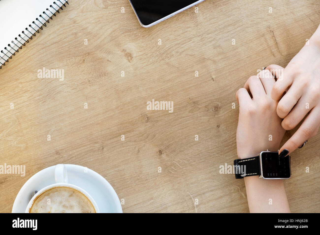 Cup of coffee, notebook, watch on table Stock Photo - Alamy