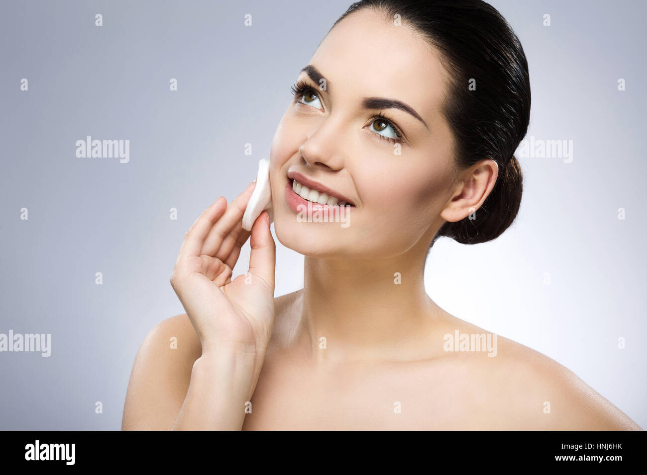 Nice girl cleaning face Stock Photo - Alamy