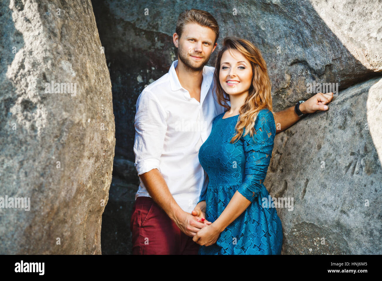 Couple embracing looking mountains hi-res stock photography and images ...
