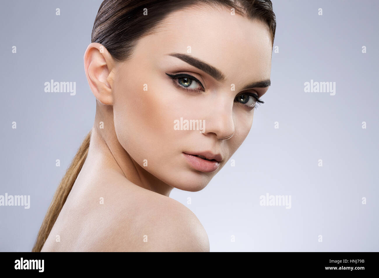 Gorgeous make up model at gray background Stock Photo - Alamy