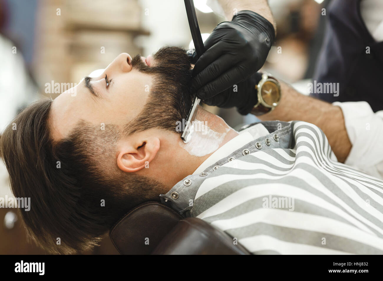 Hands in gloves making beard form Stock Photo - Alamy