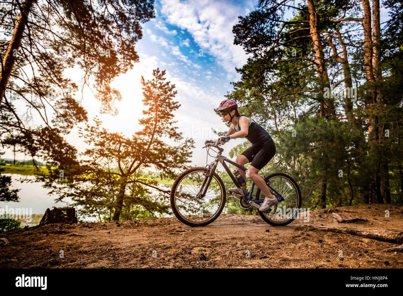 Women on the nature of riding a bike Stock Photo - Alamy