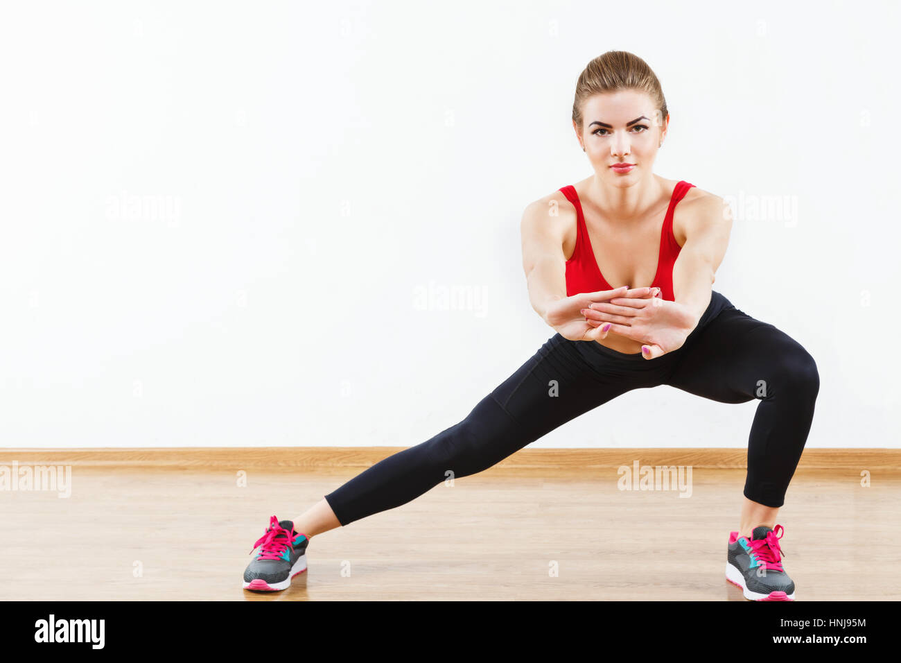 Fit girl doing physical exercises Stock Photo - Alamy