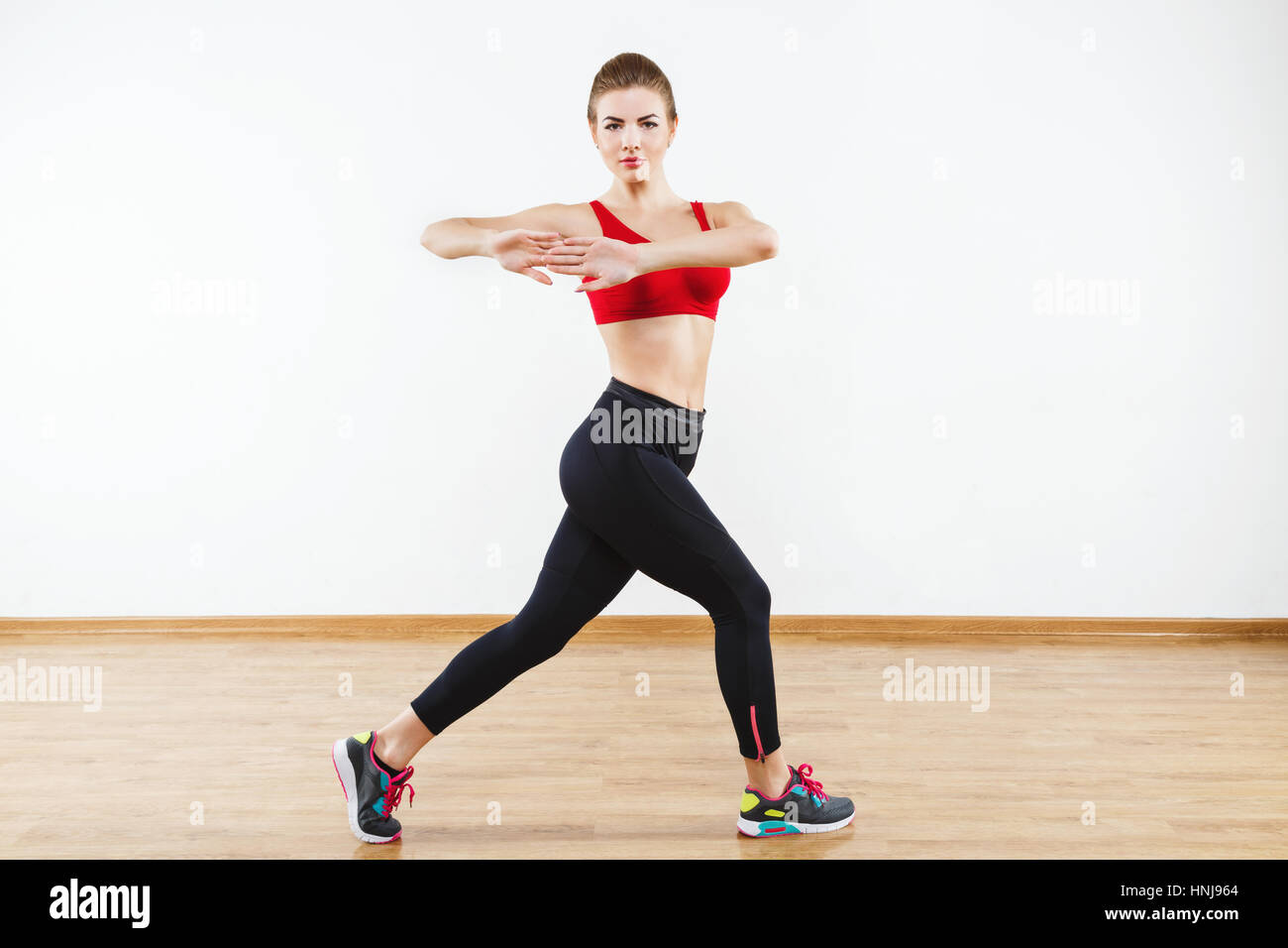 Fit girl doing physical exercises Stock Photo - Alamy