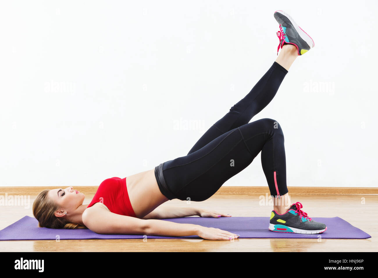 Fit girl doing physical exercises Stock Photo - Alamy