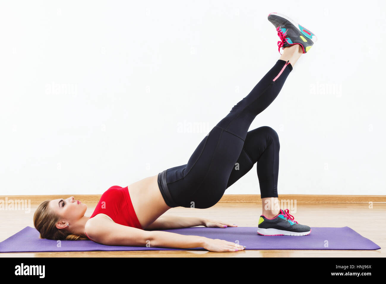 Fit girl doing physical exercises Stock Photo - Alamy