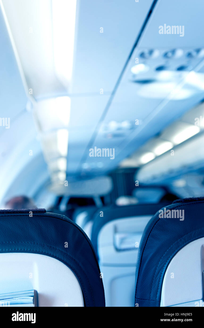 Seating row in an airplane Stock Photo - Alamy