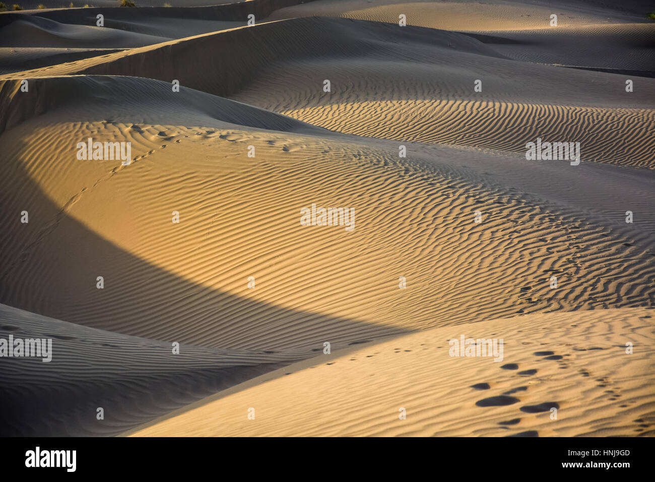 shadows of Sand dunes in desert Dasht-e Kavir at sunset, Farahzad, Iran ...