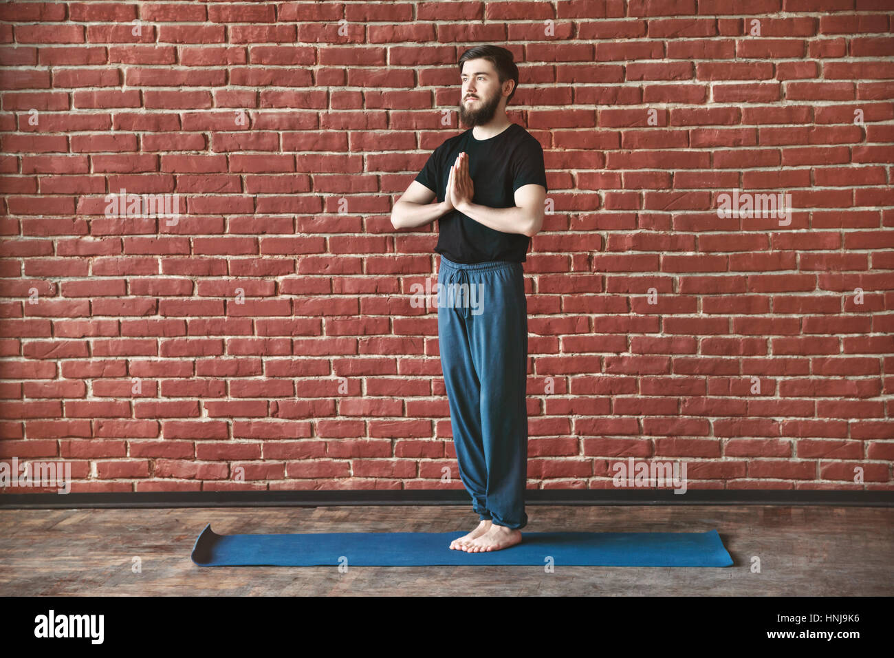 Handsome man doing yoga positions Stock Photo - Alamy