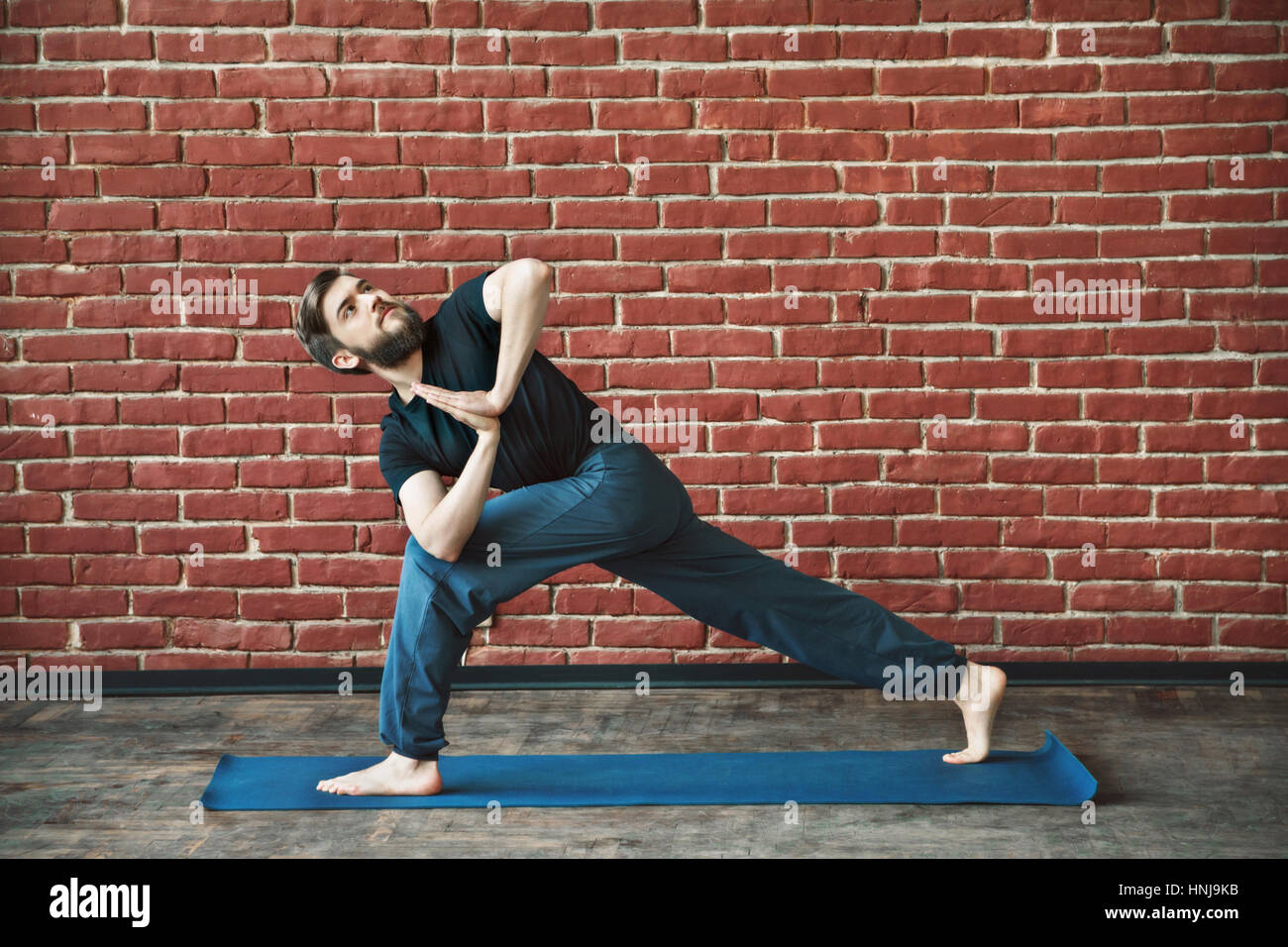 Yoga positions at wall background Stock Photo - Alamy