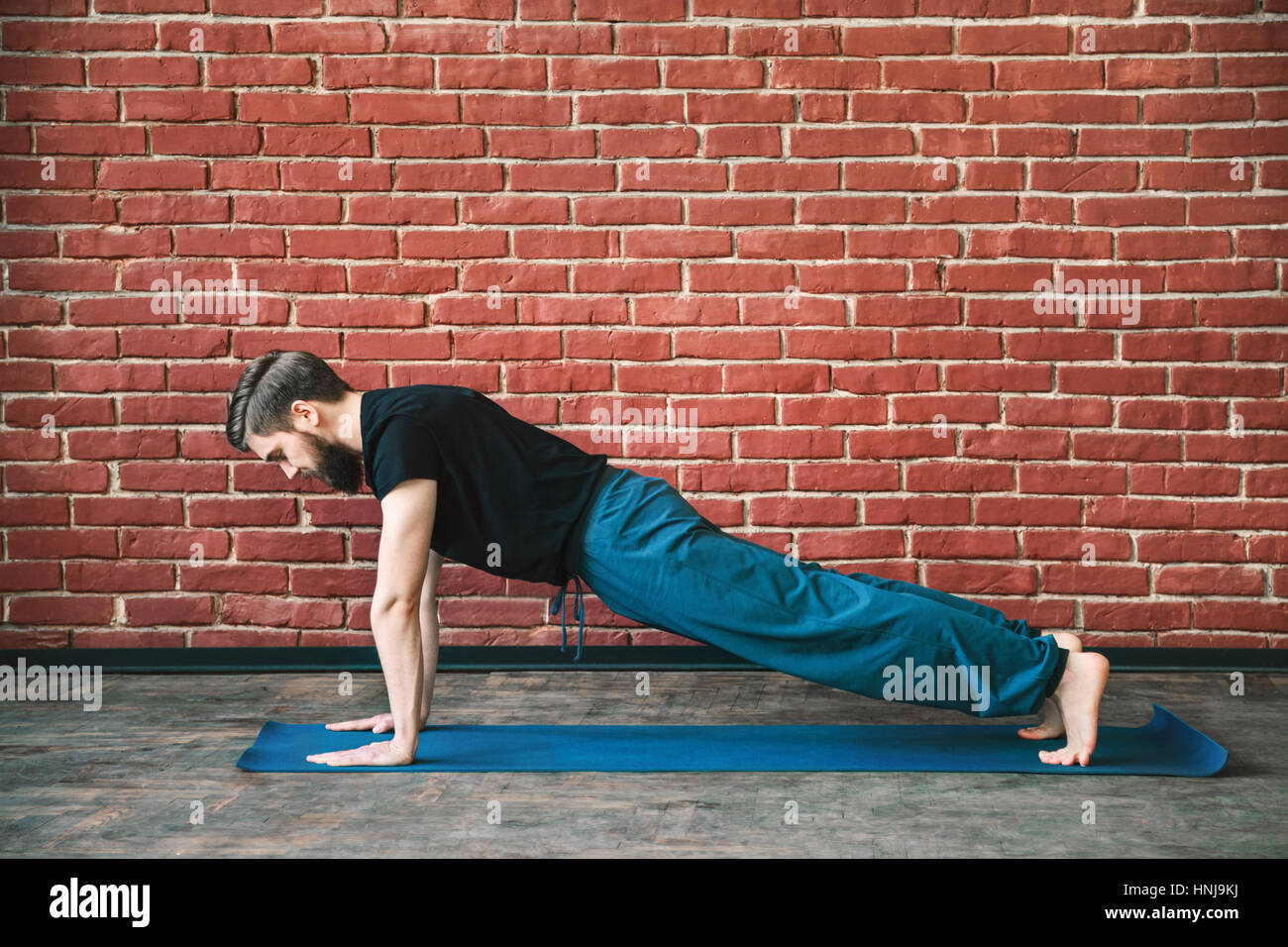 Yoga positions at wall background Stock Photo - Alamy