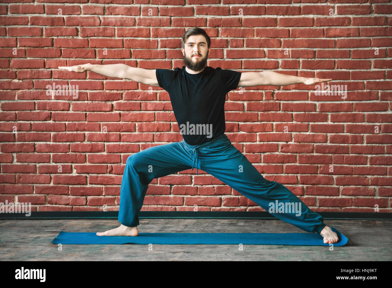 Young man practice yoga Stock Photo - Alamy