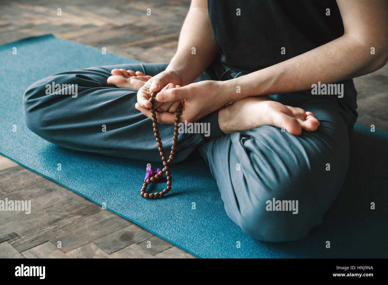 Man doing yoga positions Stock Photo - Alamy
