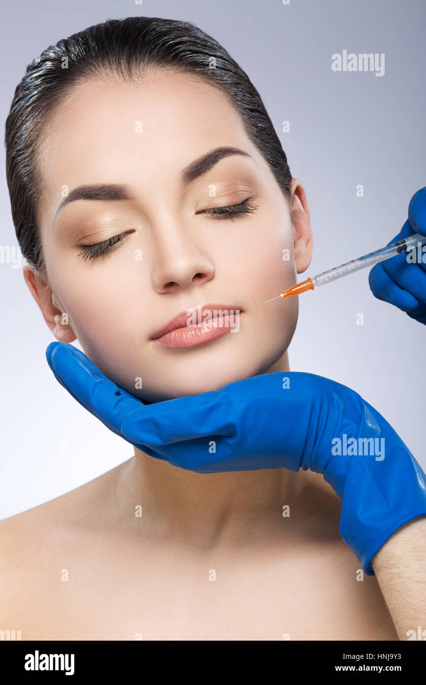 Female patient having botox injection hi-res stock photography and ...