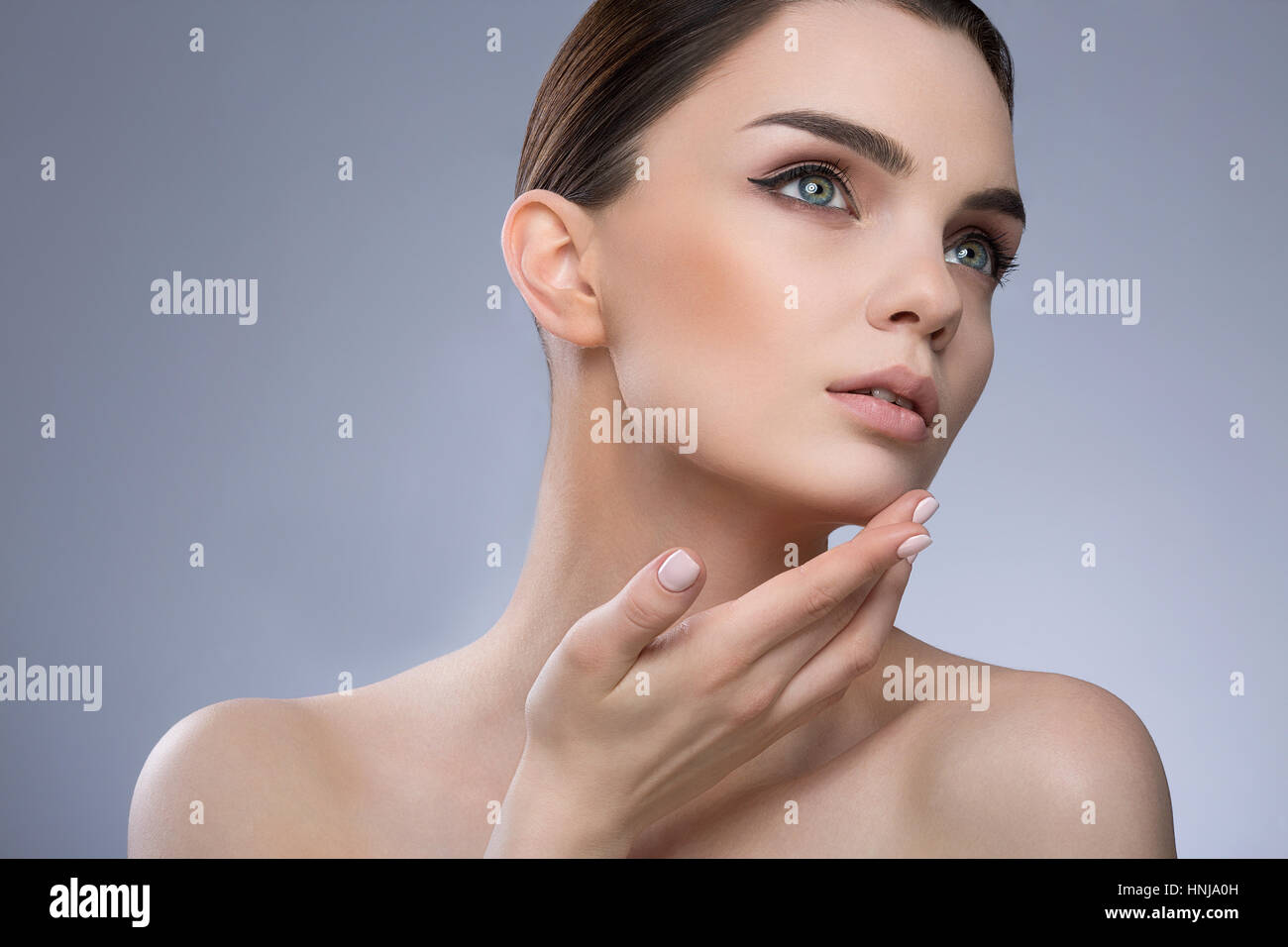 Lovely model at gray background Stock Photo - Alamy