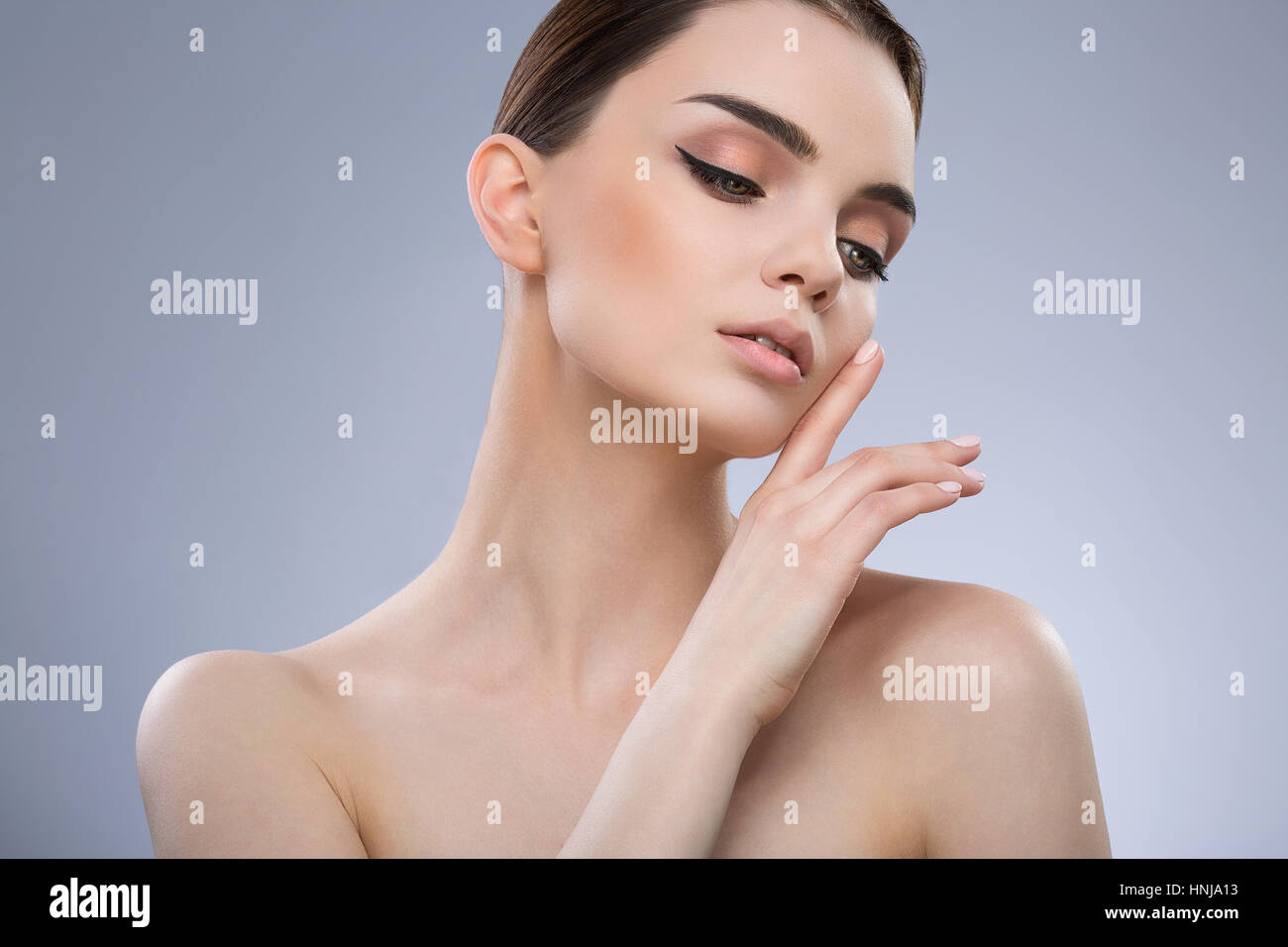 Lovely model at gray background Stock Photo - Alamy